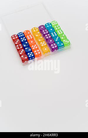 box of multicolored dice on a white background with text space Stock ...