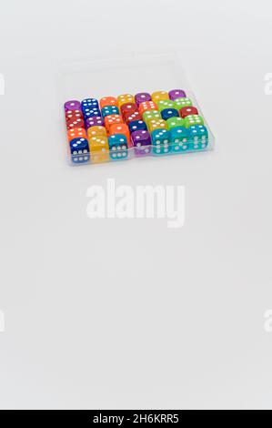 box of multicolored dice on a white background with text space Stock ...