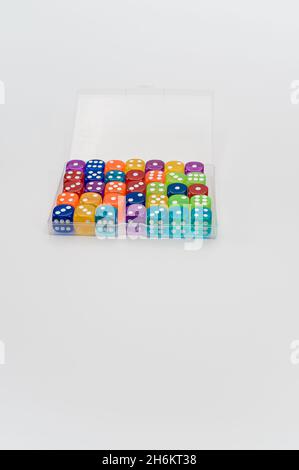box of multicolored dice on a white background with text space Stock ...