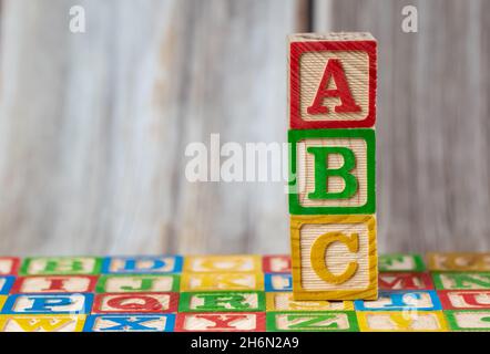ABC wooden block stack vertically Stock Photo - Alamy