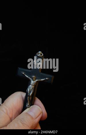 Hand holding crucifix, cross Stock Photo - Alamy