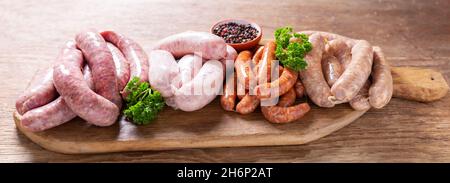 various kind of types of fresh sausages with ingredients for cooking on ...
