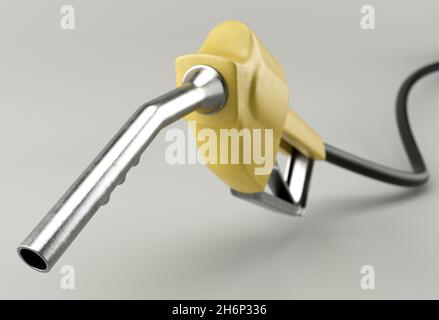 A regular yellow and metal fuel pump nozzle and pipe on an isolated ...