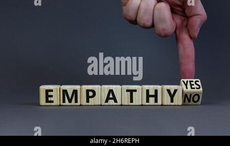 Empathy yes or no symbol. Psychologist turns wooden cubes and changes ...