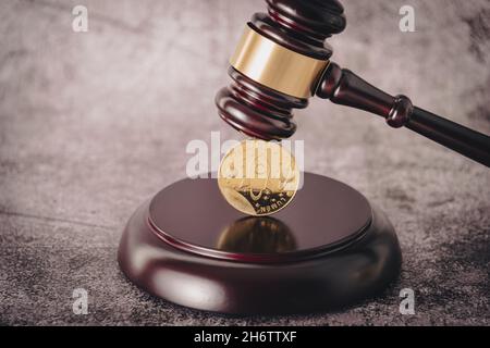Cryptocurrency under judge's gavel in foreground Stock Photo - Alamy