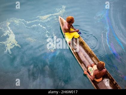 AUKI, SOLOMON ISLANDS - Dec 12, 2016: A local man rests on Auki Wharf ...