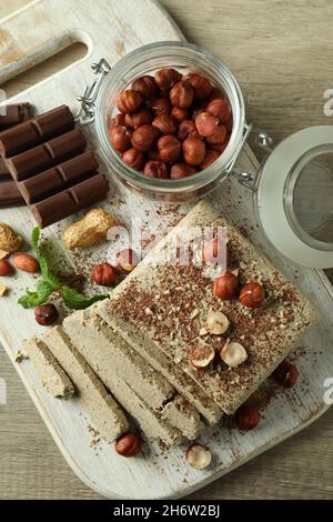 Concept of tasty food with halva on white textured background Stock Photo - Alamy
