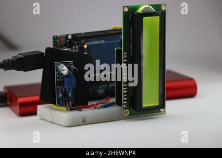 Breadboard circuit using OLED module, Pulse sensor and some wires connected to the ...