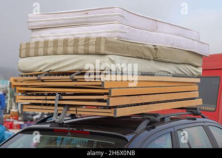 Stacked Foam Mattress Toppers and Slatted Bed Frames Stock Photo - Alamy