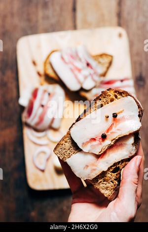 Sliced salted pork meat at wooden background Stock Photo - Alamy