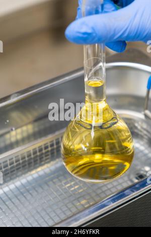 Yellow solution in the flask for dissolving or extraction into ...
