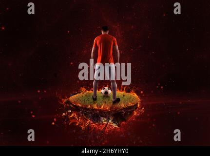 fiery soccer ball on green field Stock Photo - Alamy