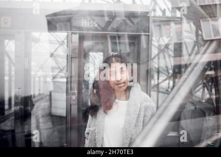 Dark-haired woman with the reflection from the glass Stock Photo - Alamy