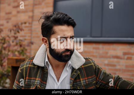 Sad gloomy bearded mature man lean head palm frowning look upper left ...