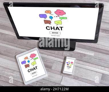 Chatting concept shown on different information technology devices ...