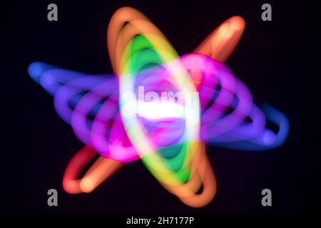 Abstract rainbow path of moving LED light on black backgroung Stock ...