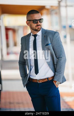 Vertical shot of a young beautiful Caucasian female posing outdoors ...