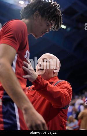 Stony Brook head coach Geno Ford directs his team against Seton Hall ...