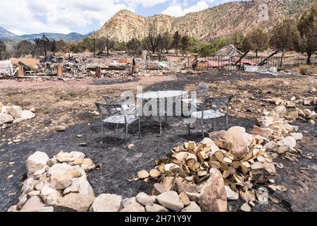 Burned out remains of a residence destroyed by the Pack Creek Wildfire ...
