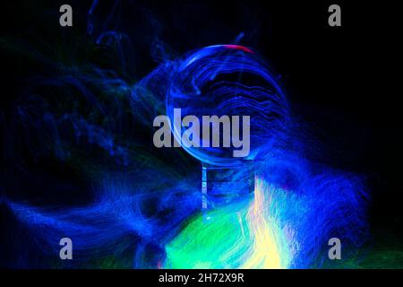 A closeup shot of glittering green crystal isolated in green background ...