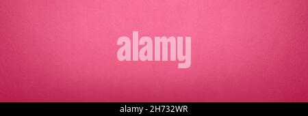 Pink sheet paper. Large banner in the hands of a woman closeup isolate ...