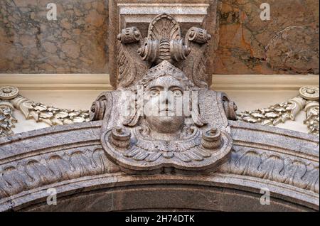 Decorative face sculpture on facade Stock Photo - Alamy