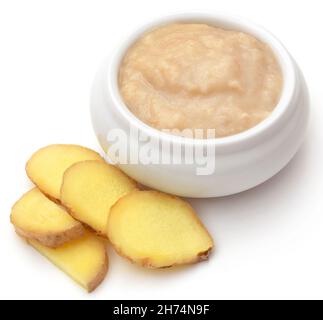 Ginger with paste over white background Stock Photo - Alamy