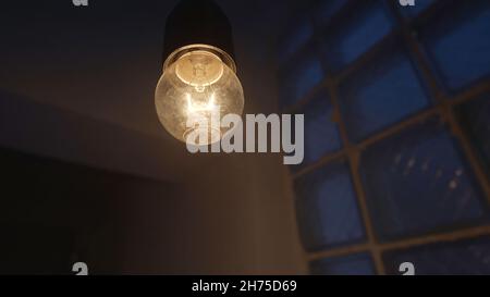 Incandescent lamp in interior. Weak light from interior lamp. Red-hot ...