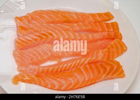 Fresh raw salmon strips Stock Photo - Alamy