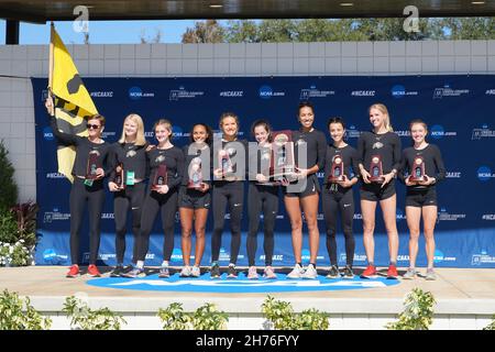 The Colorado Buffaloes women's team pose with team trophy after placing ...