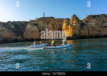 Lagos, Portugal, Group Tourists visiting in Tour Boat, Atlantic Ocean ...