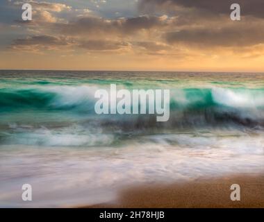 A long exposure of sea waves hitting the rocks Stock Photo - Alamy
