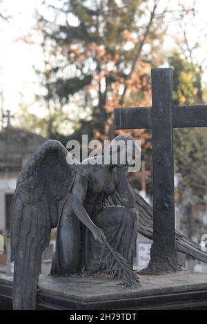 sad angel near cross Stock Photo - Alamy