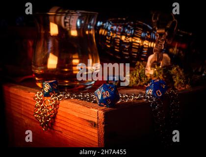 Close-up image of a blue d20 in warm light on a wooden surface Stock ...