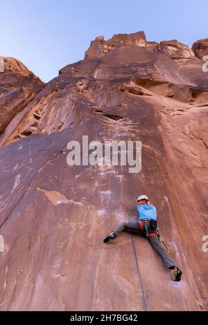 Rock climbers on sandstone cliff near Moab, Utah Stock Photo - Alamy