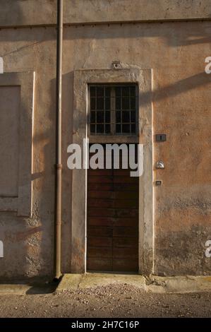 Door of buiding in Arona in oblique light Stock Photo - Alamy