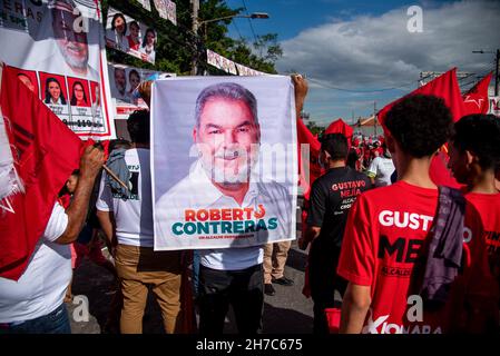 A supporter carries a poster of presidential candidate Ivan Cepeda of ...