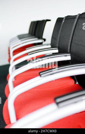 Conference room with red chairs in a row Stock Photo - Alamy