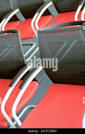 Conference room with red chairs in a row Stock Photo - Alamy