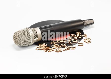 Retro microphone with music notes on color background Stock Photo - Alamy