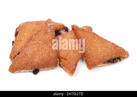 Baked goods with raisin in the shape of triangles isolated on white ...