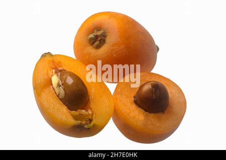 Loquats, whole and halved Stock Photo - Alamy