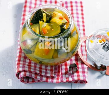Pickled courgettes with turmeric and mustard seeds in a jar Stock Photo ...