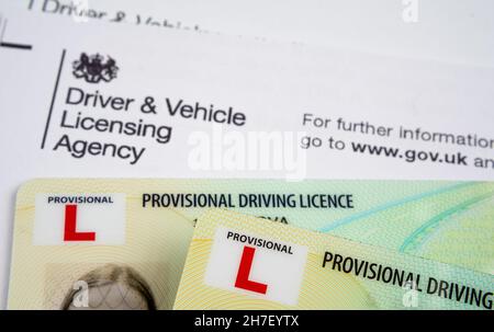 UK Provisional Driving Licence cards placed on top of the genuine ...