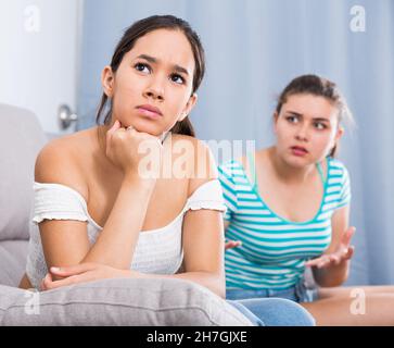 Quarrel between two teens girls friends in home interior Stock Photo ...