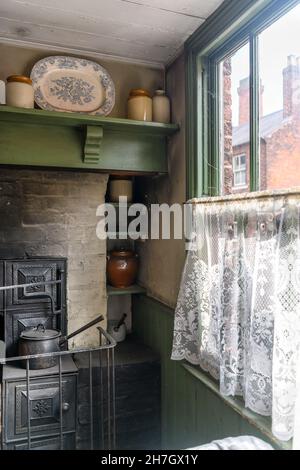 Old Victorian range in old fashioned blue kitchen with basket of ...
