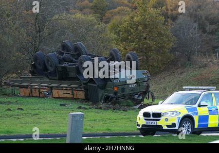 An overturned army vehicle sits in the middle of the Keir roundabout on ...