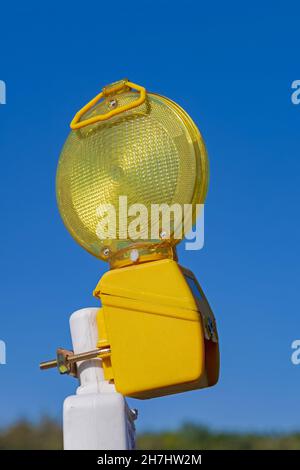 Amber Flashing Light at Top of Construction Site Barrier Stock Photo ...