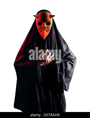 Isolated scary horror occult sectarian priest in black hood and metal ...