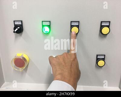 hand touch on button machine in factory industrial Stock Photo - Alamy
